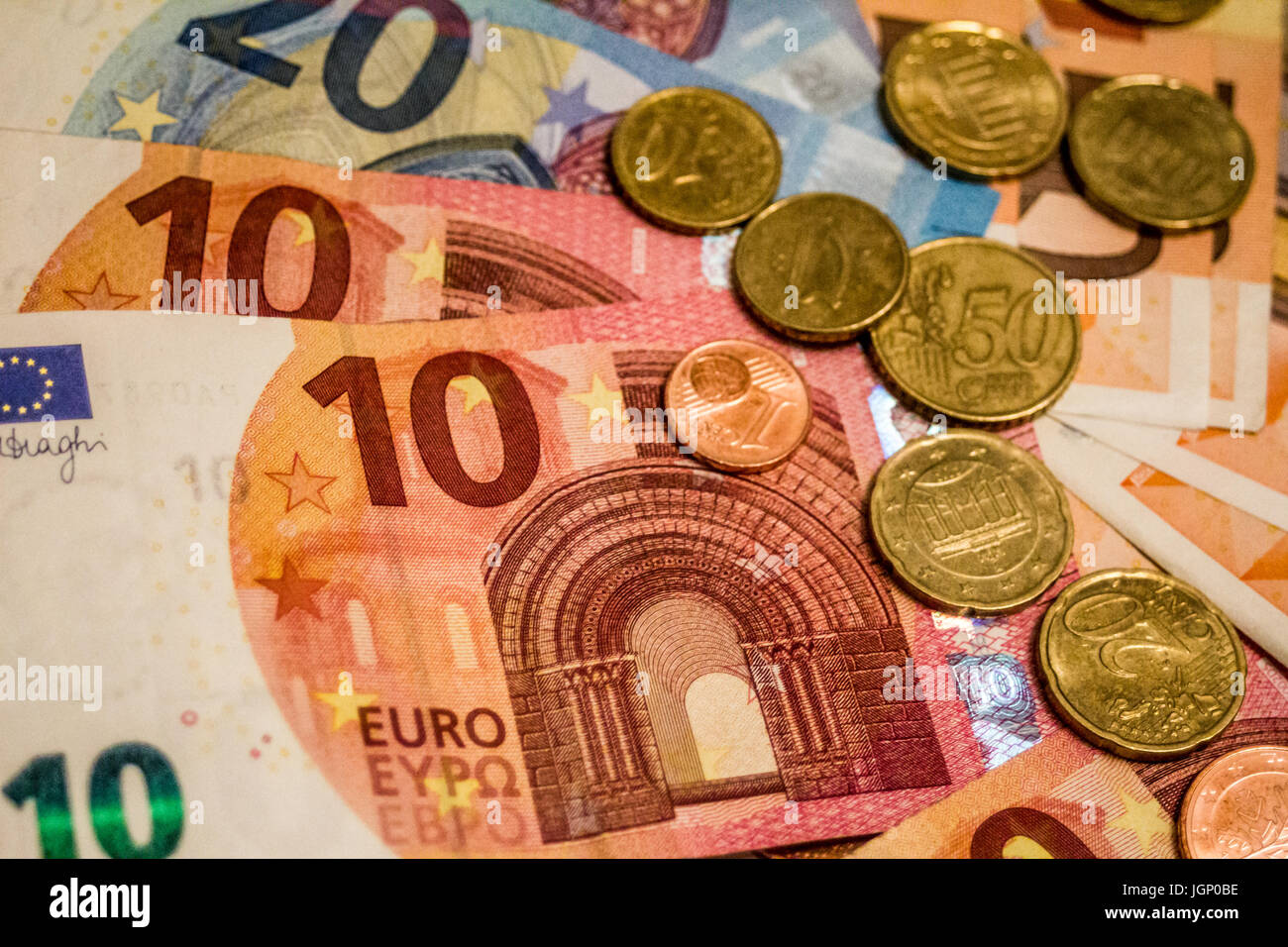 A composition of euro banknotes and coins providing great options to be ...