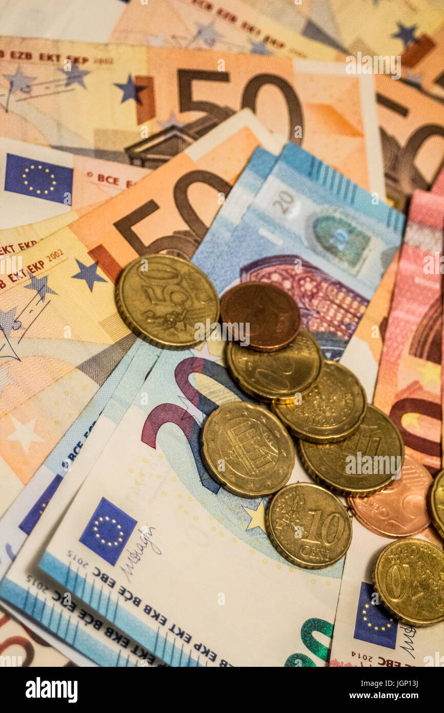A composition of euro banknotes and coins providing great options to be ...