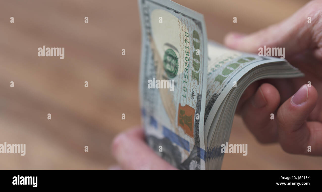 Flipping dollar bills hi-res stock photography and images - Alamy