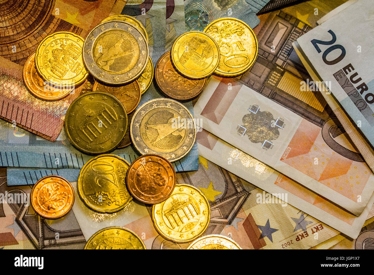 A composition of euro banknotes and coins providing great options to be ...