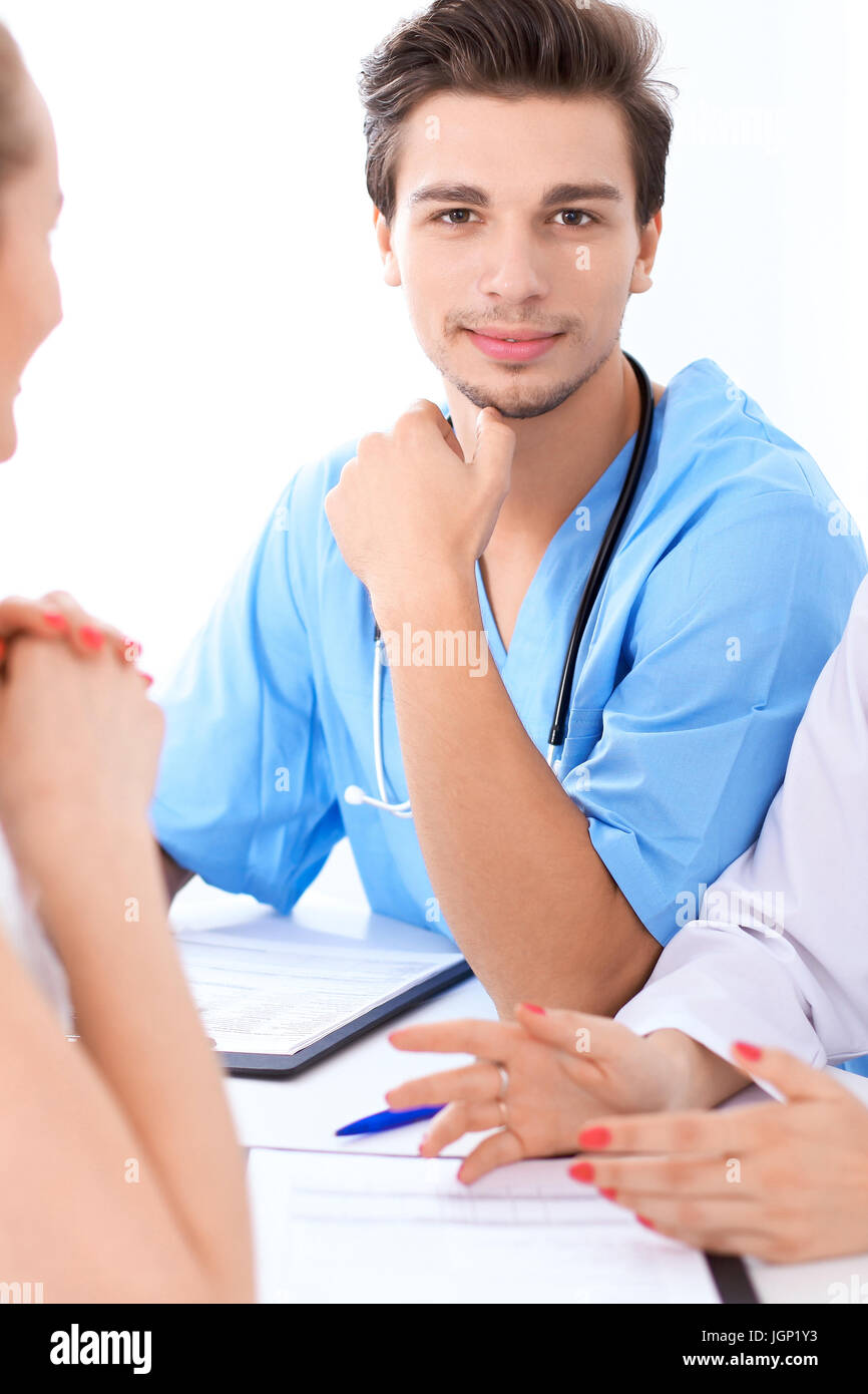 Attractive male surgeon doctor at medical meeting or patient ...