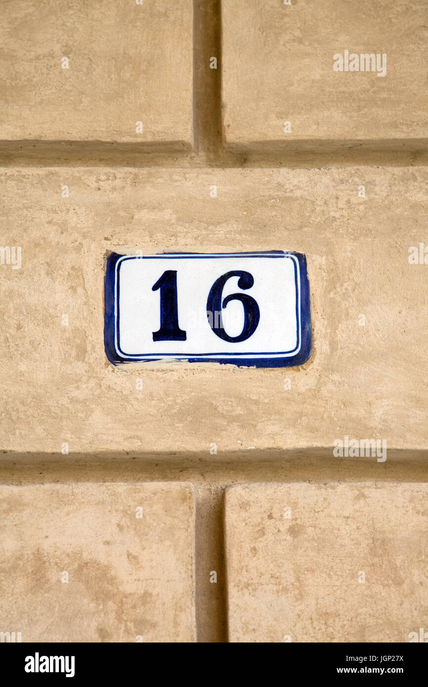 Number Sixteen on Stone Wall Stock Photo - Alamy