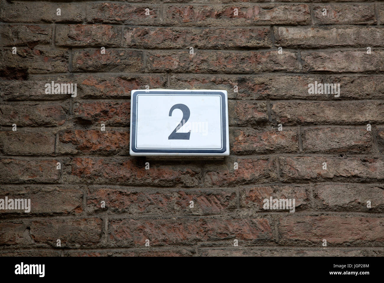 Number Two Sign on Brick Wall Stock Photo - Alamy