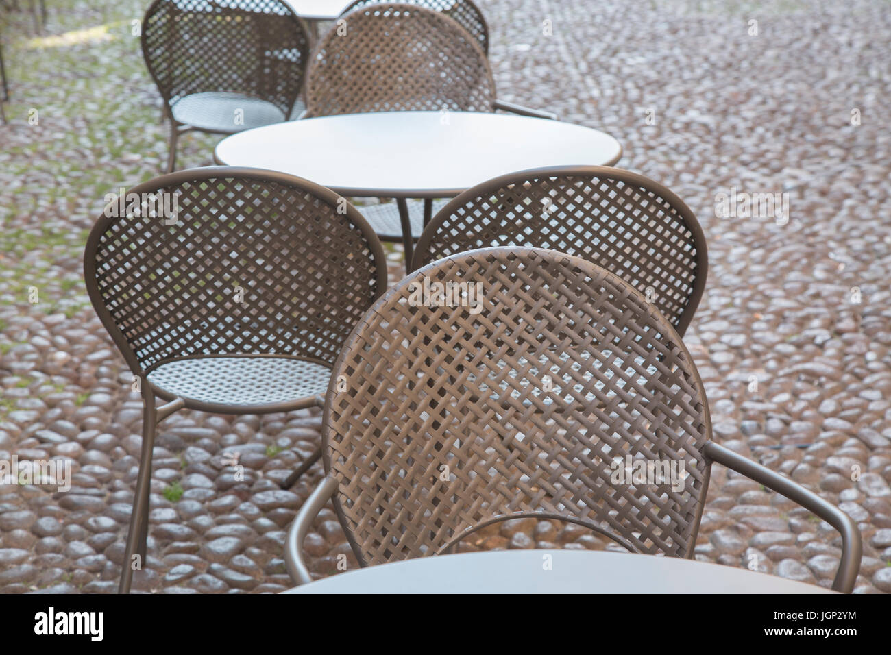 Cafe Table and Chairs on Cobblestone Street, Bologna, Italy Stock Photo ...