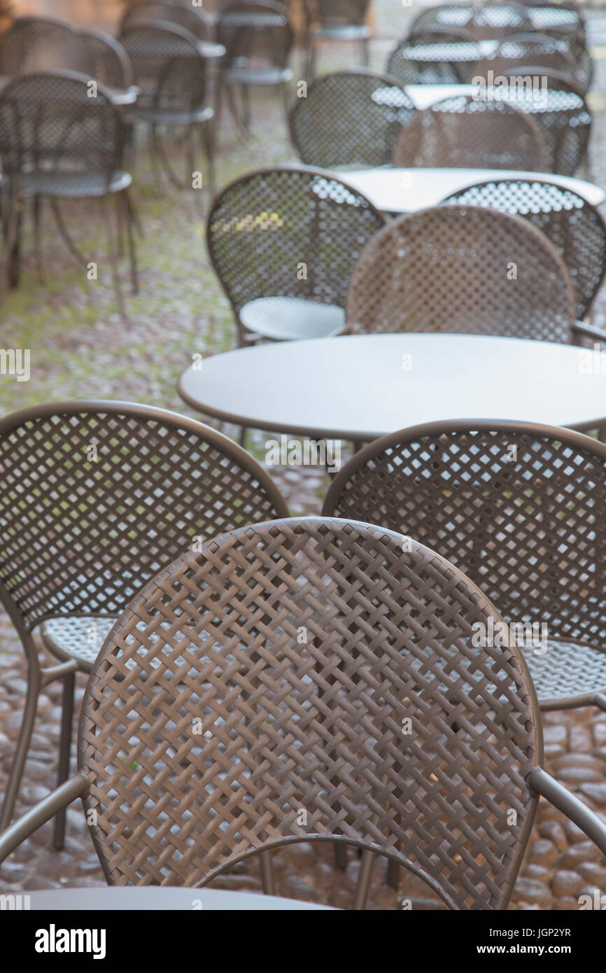 Cafe Table and Chairs on Cobblestone Street, Bologna, Italy Stock Photo ...