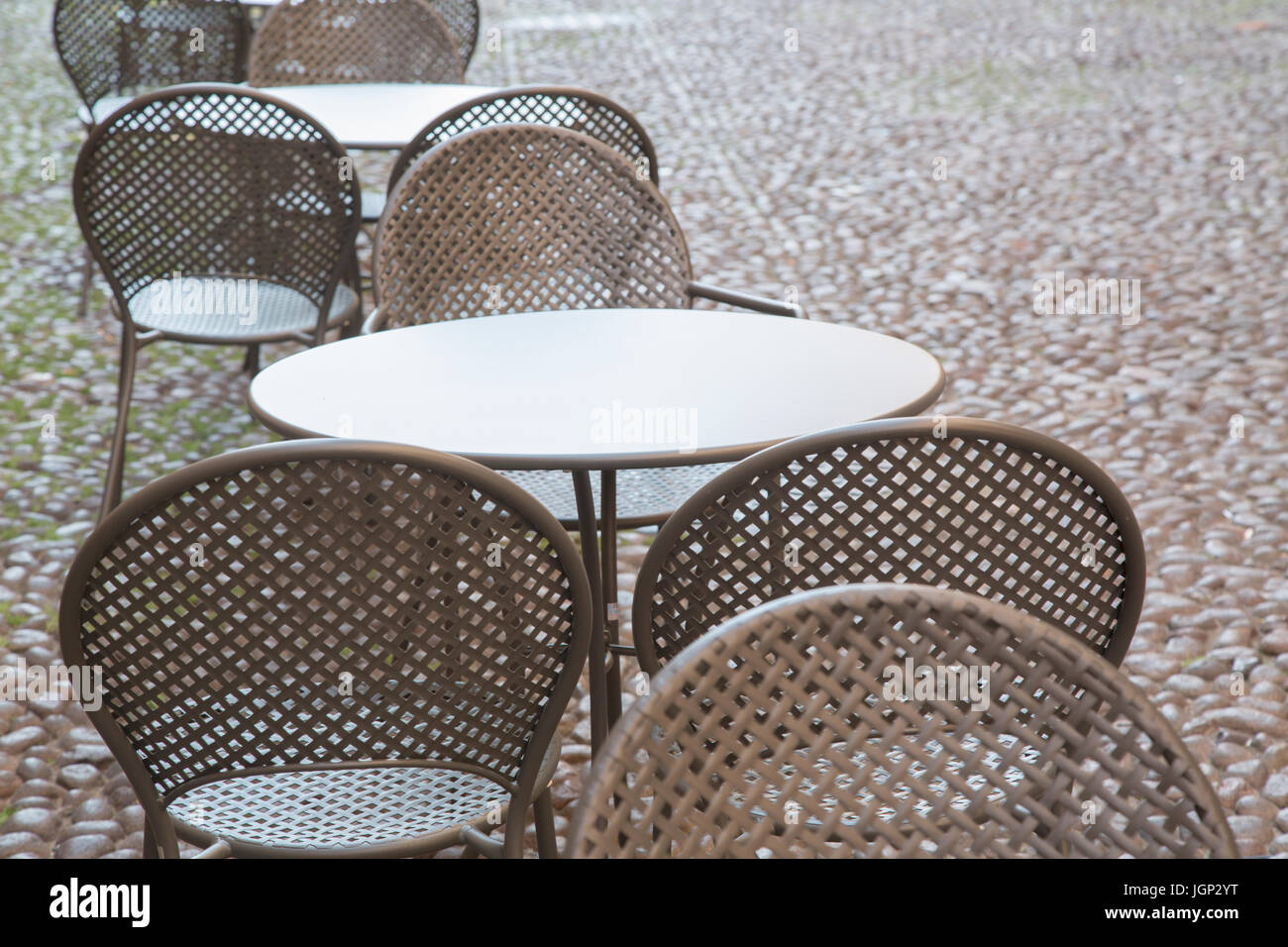 Cafe Table and Chairs on Cobblestone Street, Bologna, Italy Stock Photo ...