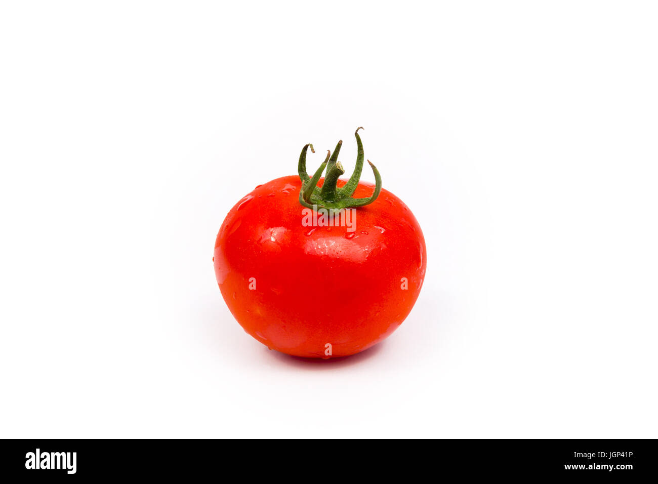Single tomato on white background Stock Photo - Alamy