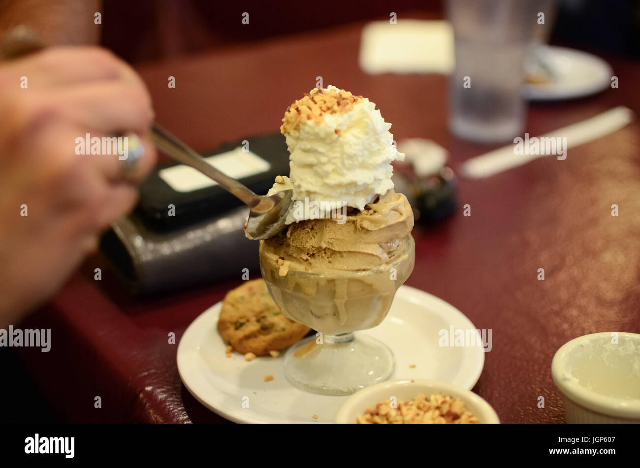 Eating an ice cream sundae Stock Photo - Alamy