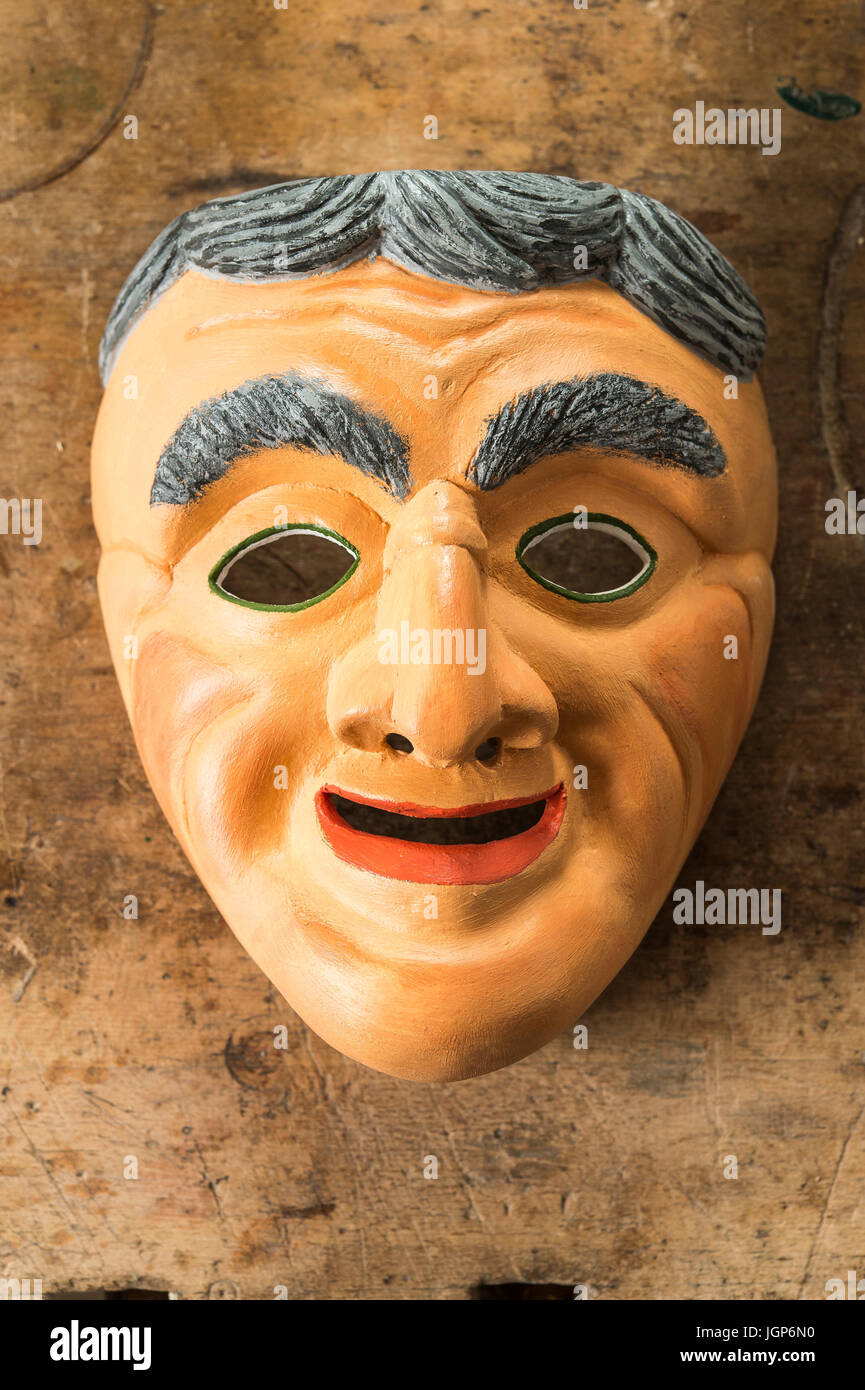 Painted wooden mask on a workbench, wooden mask carver, Bad Aussee ...