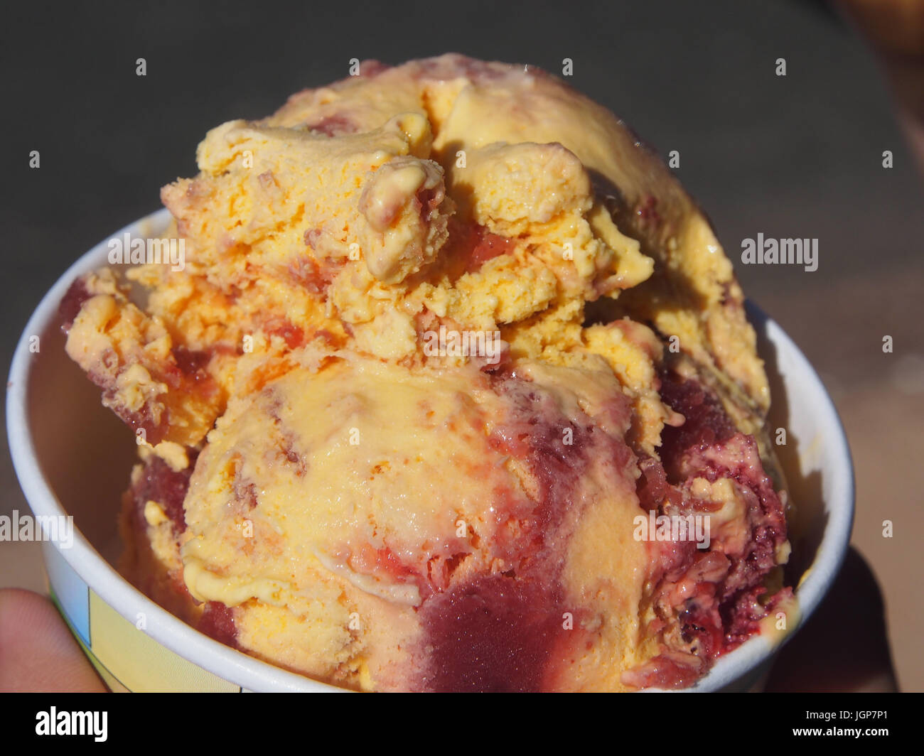 Brightly coloured ice cream in a tub Stock Photo - Alamy