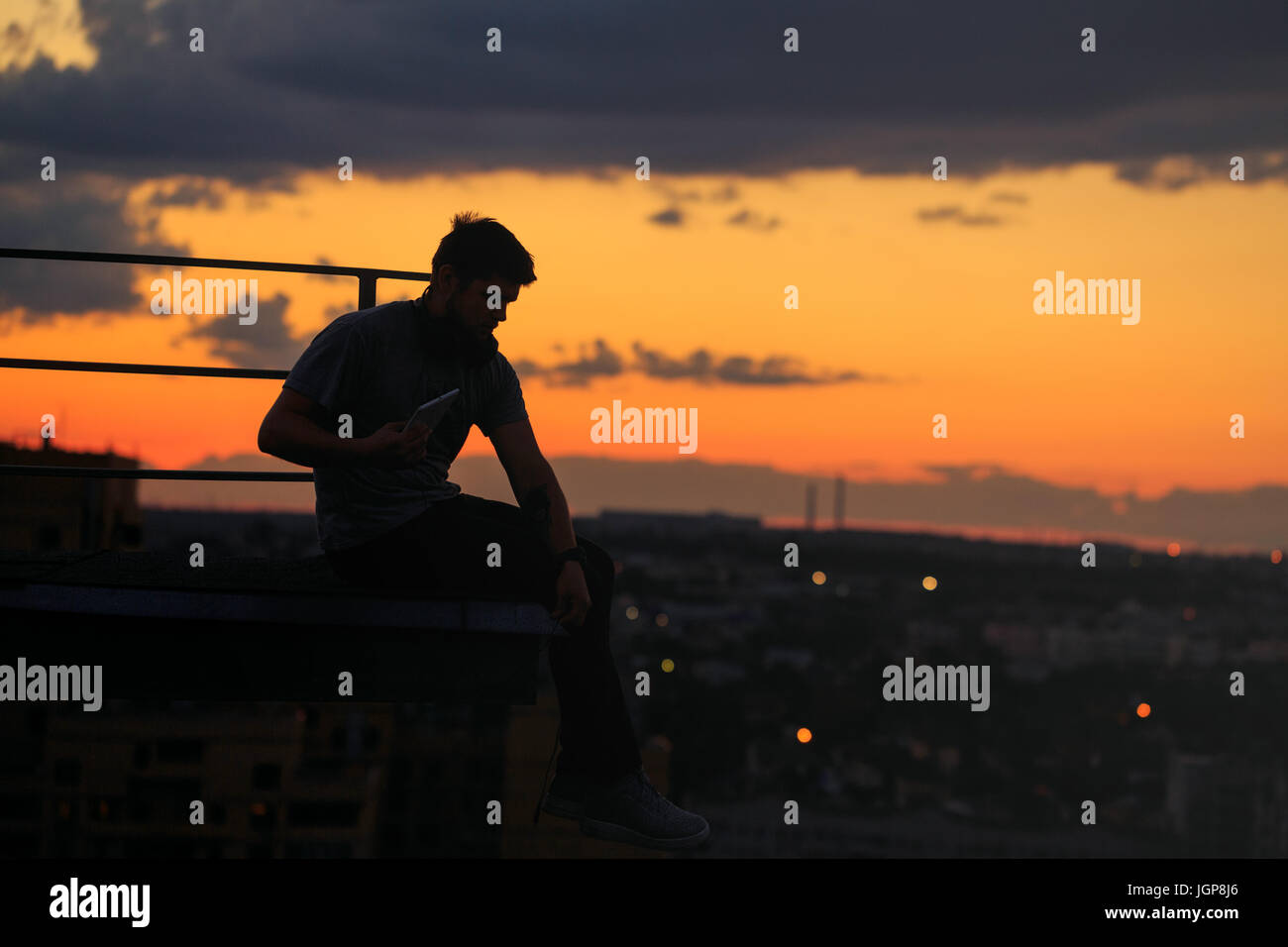 Man standing edge roof hi-res stock photography and images - Alamy