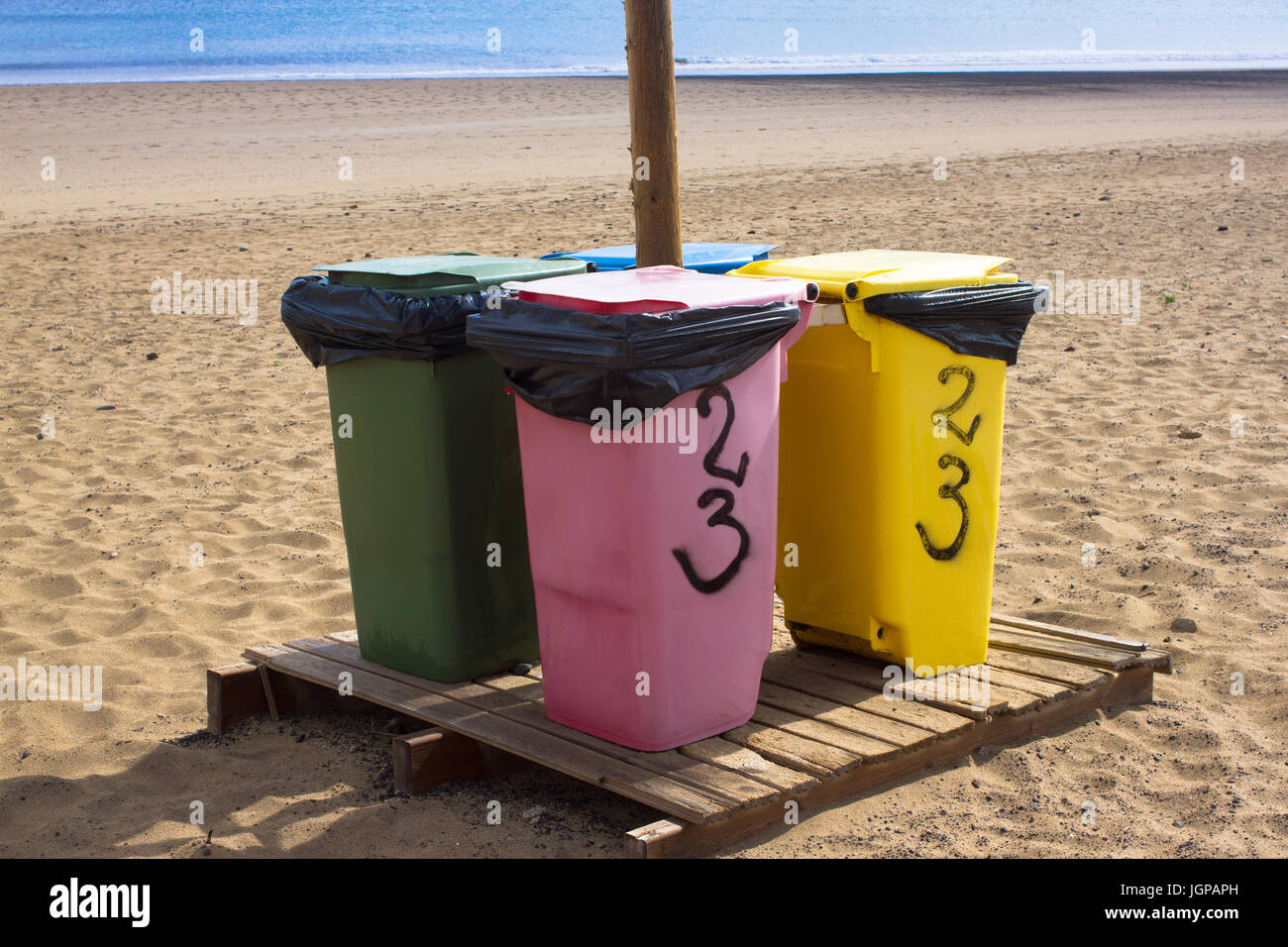 Four recycle bins for different waste. Paper, glass, food, plastic ...
