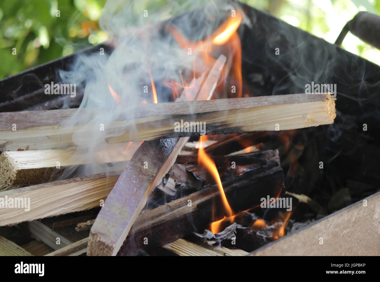 Starting up bbq fire Stock Photo - Alamy