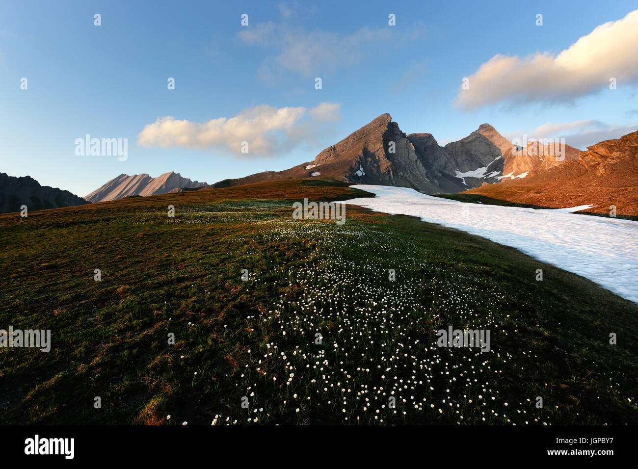 Sunset in French Alps with rocky mountains for the backdrop and snow ...