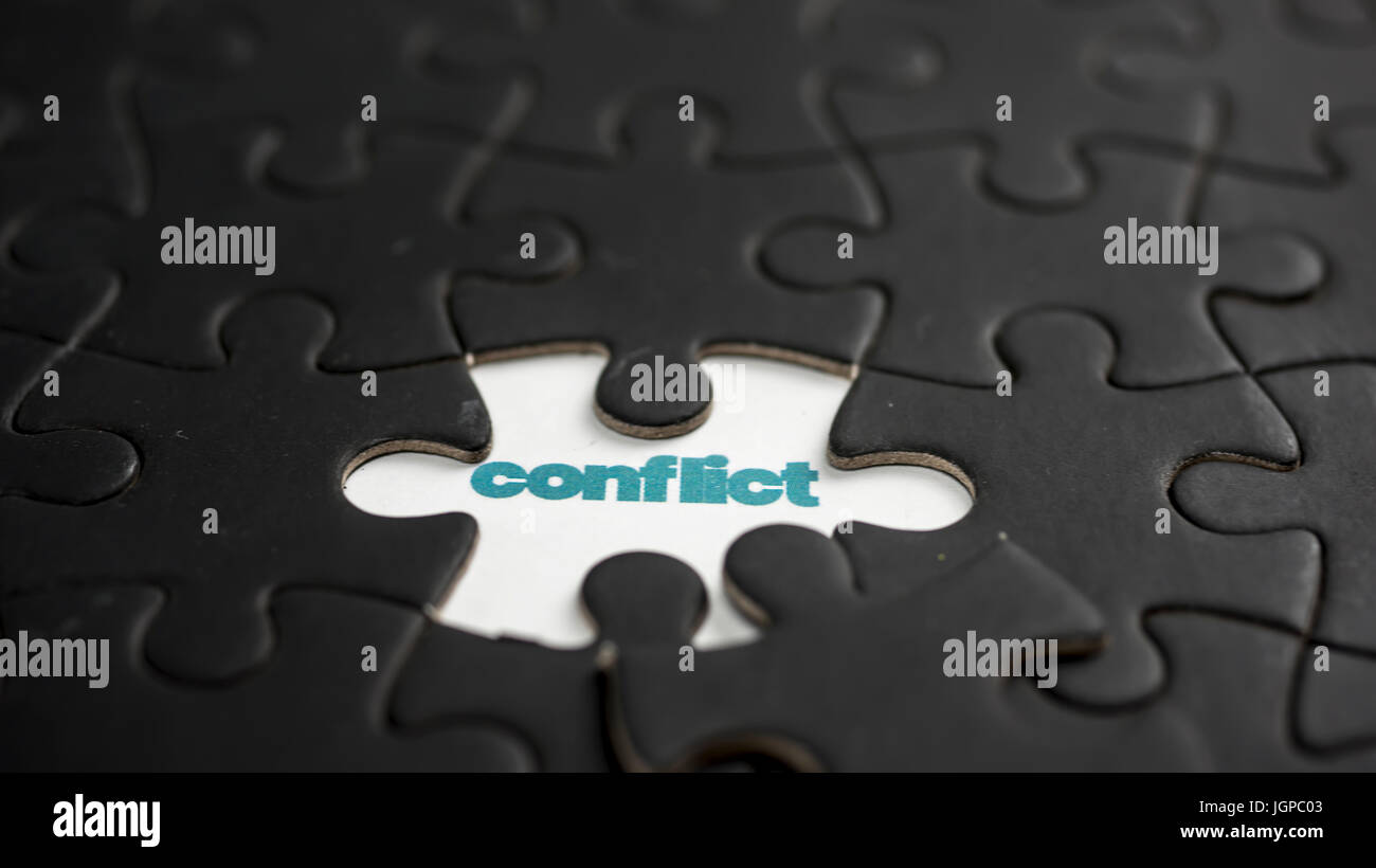 Word conflict under jigsaw puzzle piece Stock Photo - Alamy Word conflict under jigsaw puzzle piece Stock Photo - Alamy