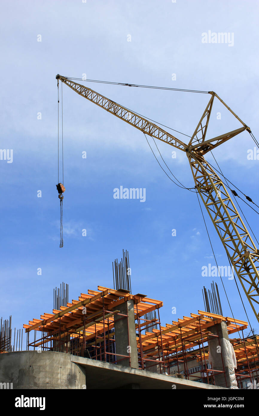 Crane elements on building in the city Stock Photo - Alamy