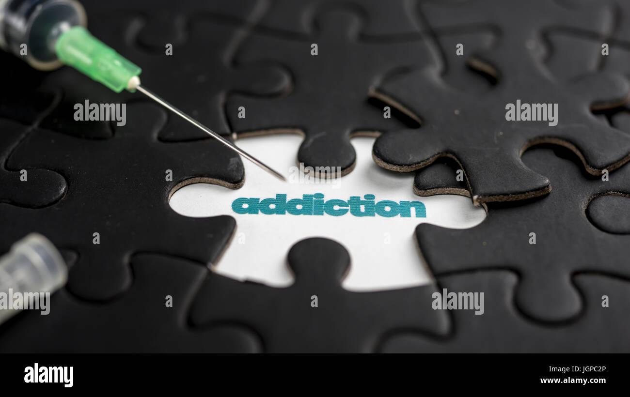 Word addiction under jigsaw puzzle piece Stock Photo - Alamy