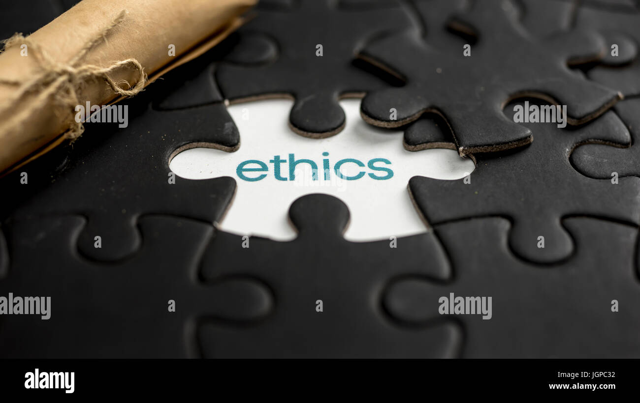 Word ethics under jigsaw puzzle piece Stock Photo - Alamy
