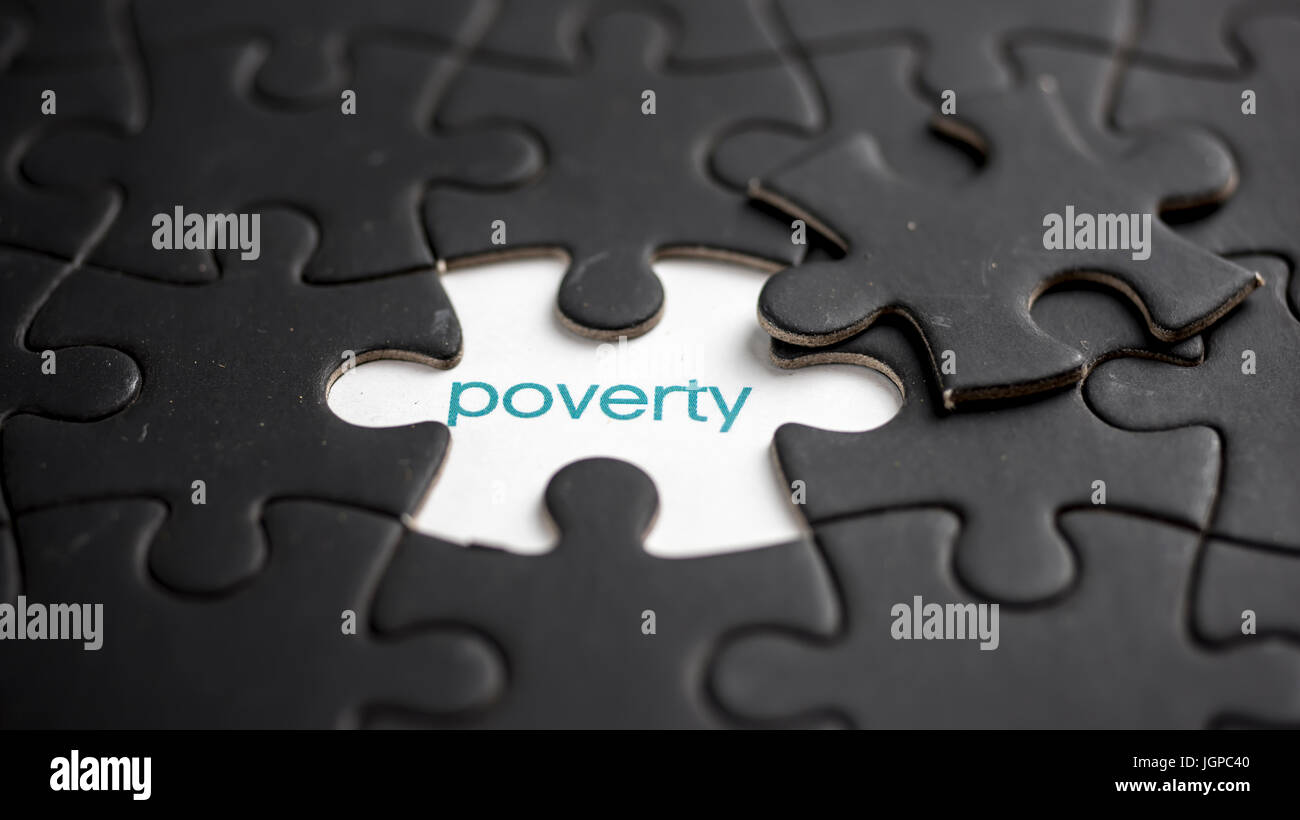 Word poverty under jigsaw puzzle piece Stock Photo - Alamy