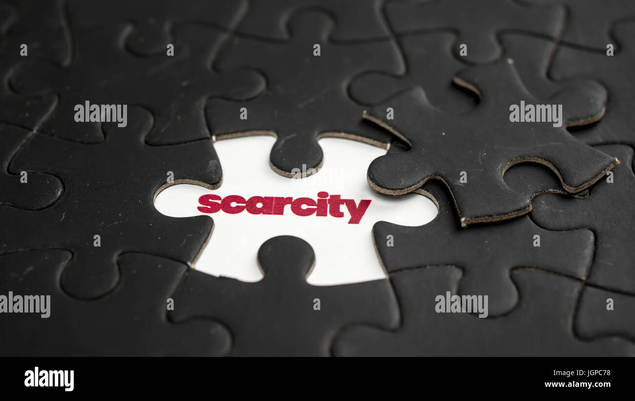 Word scarcity under jigsaw puzzle piece Stock Photo - Alamy