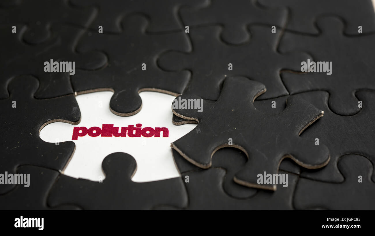 Word pollution under jigsaw puzzle piece Stock Photo - Alamy