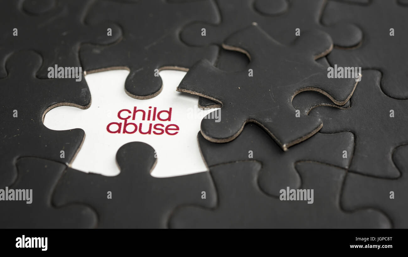 Words child abuse under jigsaw puzzle piece Stock Photo - Alamy