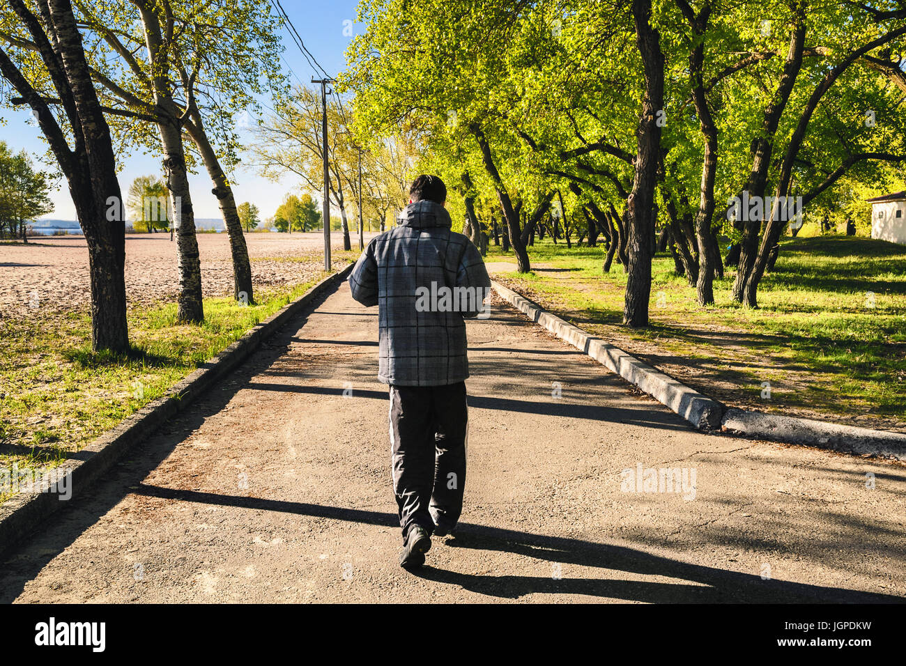 Man running in park at spring morning. Healthy lifestyle concept ...