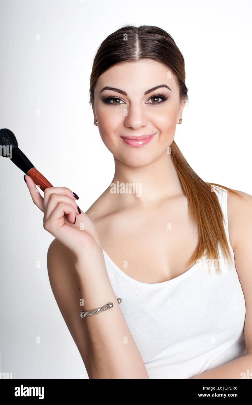 Beauty smiling happy Girl make up artist with Makeup Brush. Bright ...