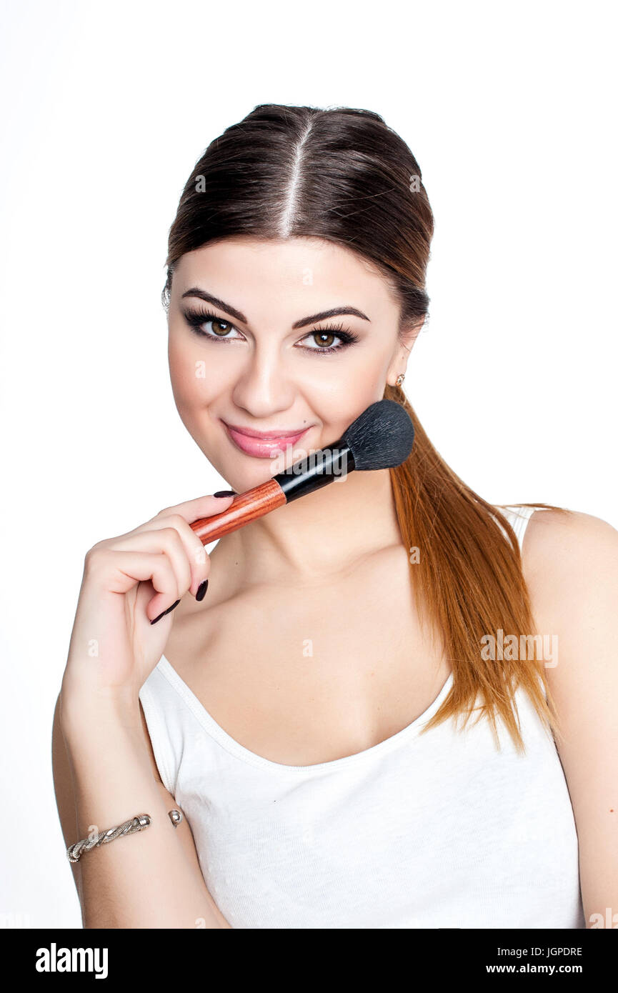 Beauty smiling happy Girl make up artist with Makeup Brush. Bright ...