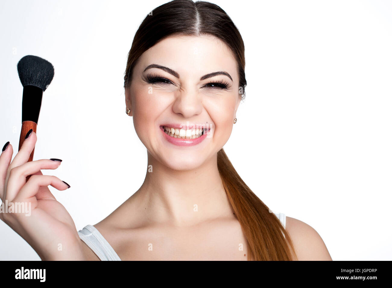 Beauty smiling happy Girl make up artist with Makeup Brush. Bright ...