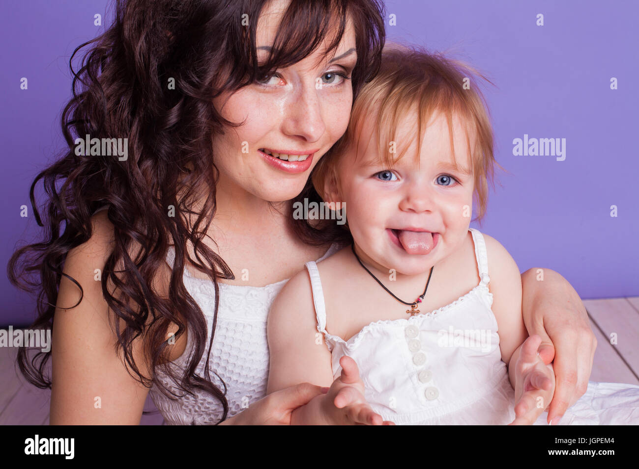 mother and little daughter play smile Stock Photo - Alamy
