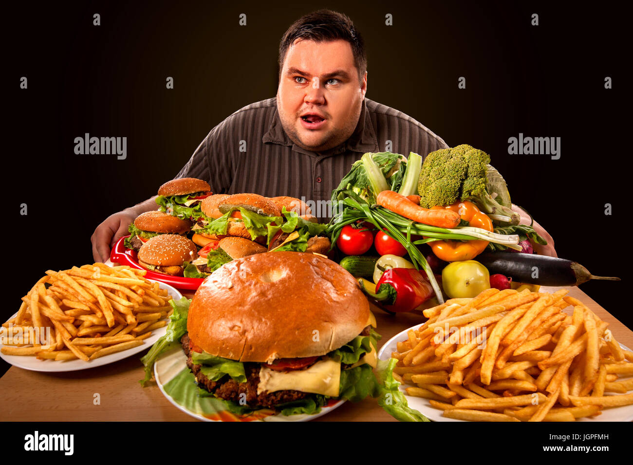 Diet fat man who makes choice between healthy and unhealthy food ...
