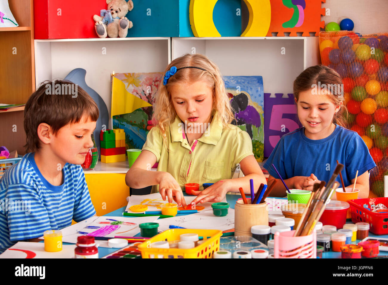 Small students children painting in art school class Stock Photo - Alamy