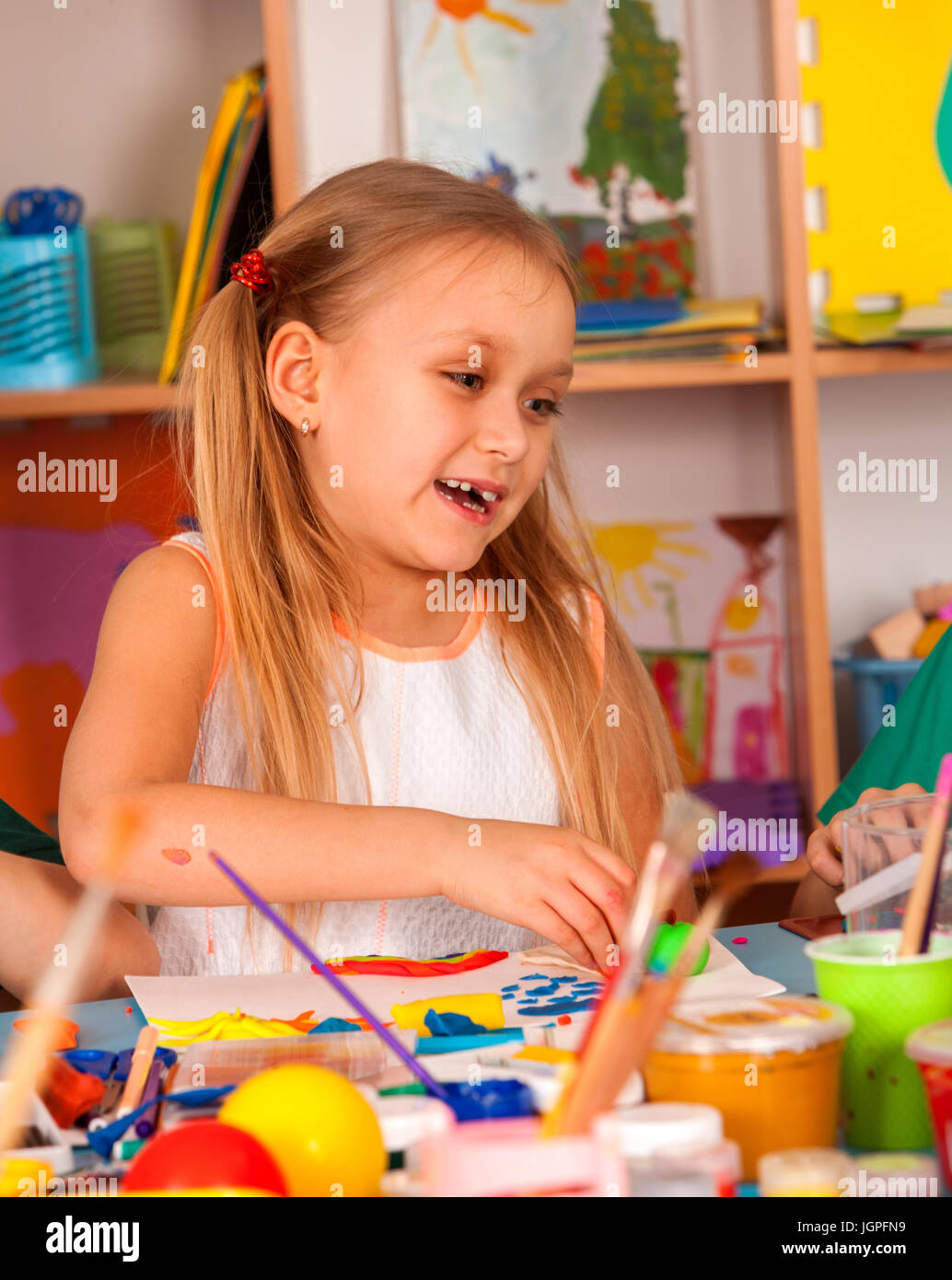 Small students children painting in art school class Stock Photo - Alamy