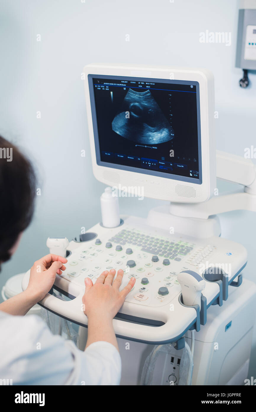 Skillful sonographer using ultrasound machine at work Stock Photo - Alamy