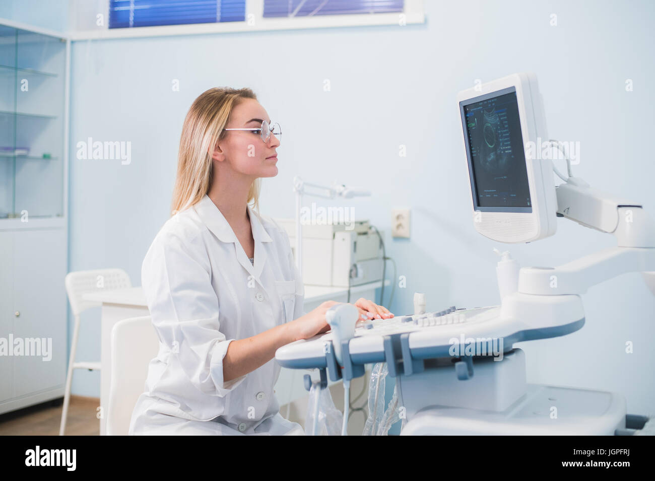 Ultrasound machine, doctor's hand usg investigation USCG Stock Photo ...