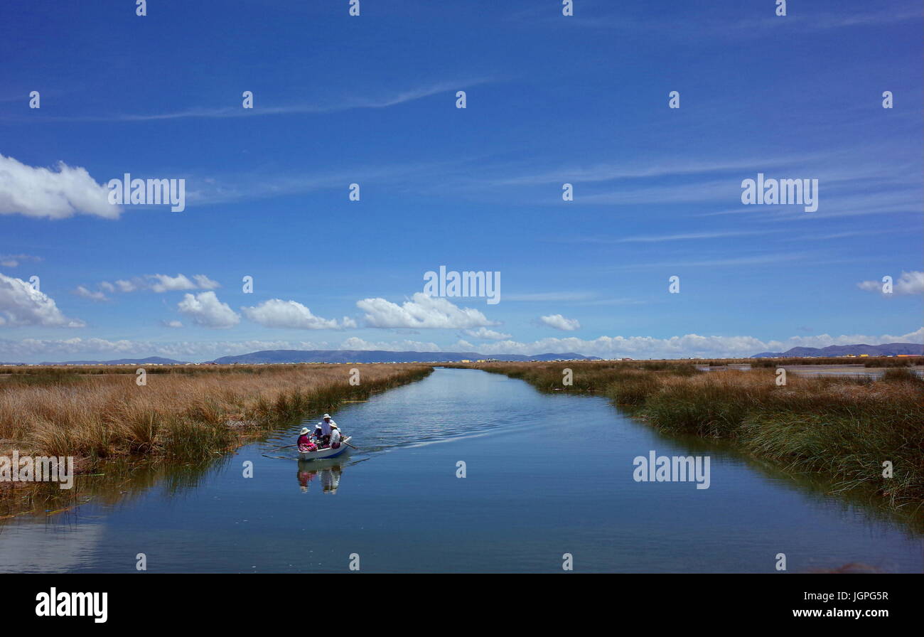 21ST DECEMBER 2016, PUNO, PERU - A family sailing in a boat from the ...