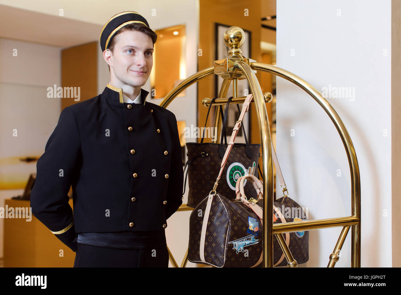 Hotel doorman and reception and lobby hi-res stock photography and ...