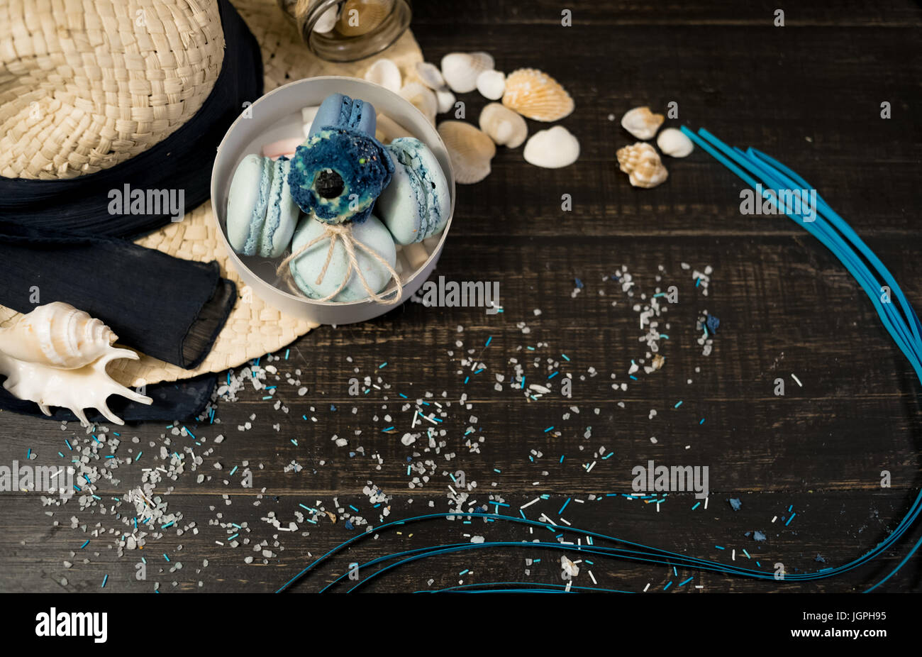 Blue and sea blue macaroons in a marine theme on a dark background ...
