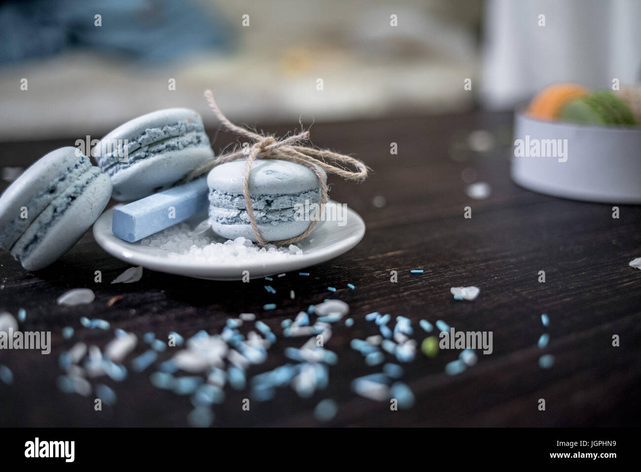 Blue and sea blue macaroons in a marine theme on a dark background ...