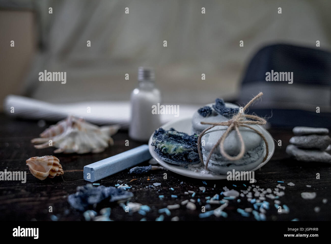 Blue and sea blue macaroons in a marine theme on a dark background ...