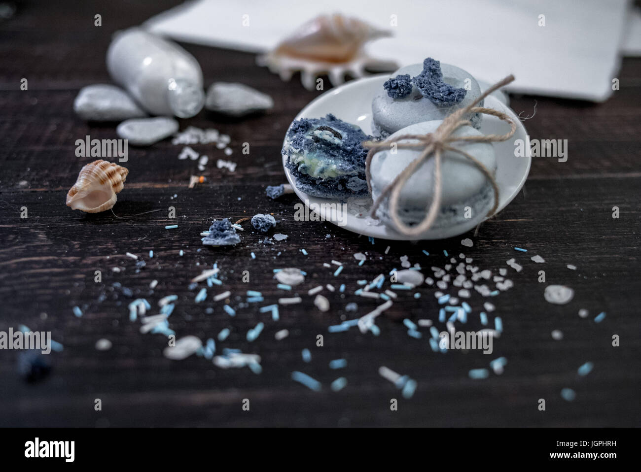 Blue and sea blue macaroons in a marine theme on a dark background ...