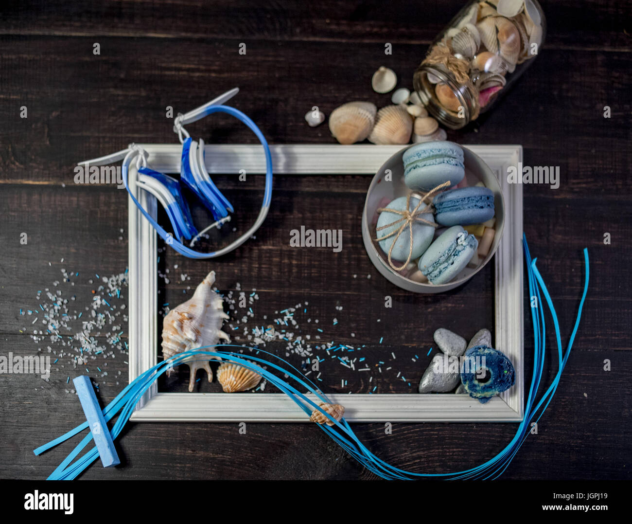 Blue and sea blue macaroons in a marine theme on a dark background ...