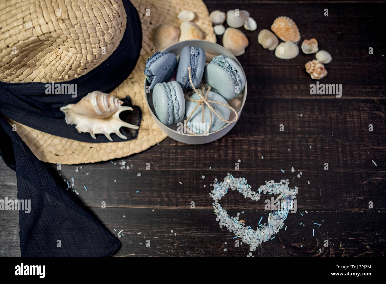 Blue and sea blue macaroons in a marine theme on a dark background ...