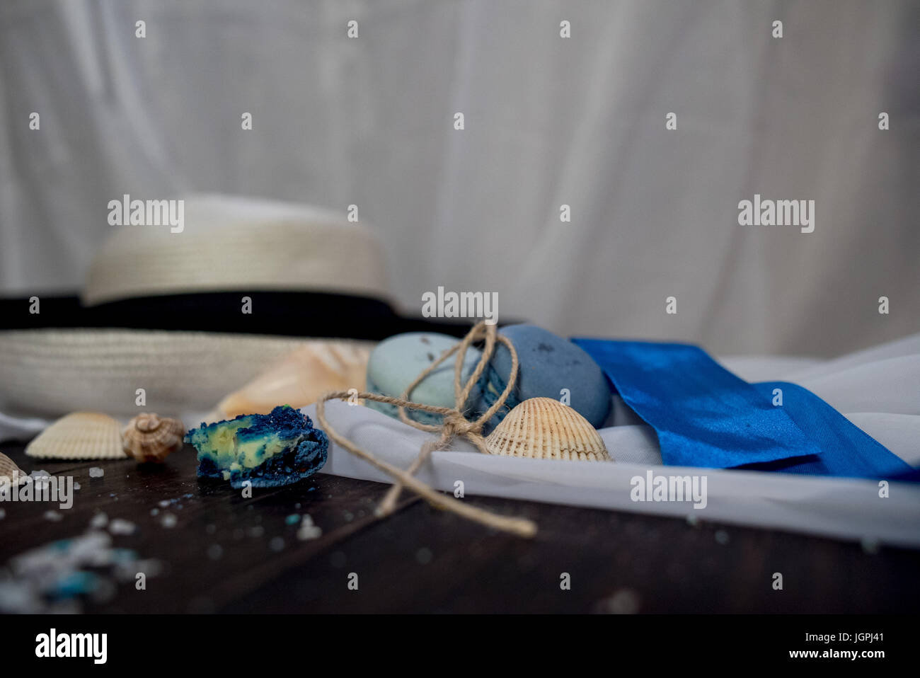 Blue and sea blue macaroons in a marine theme on a dark background ...