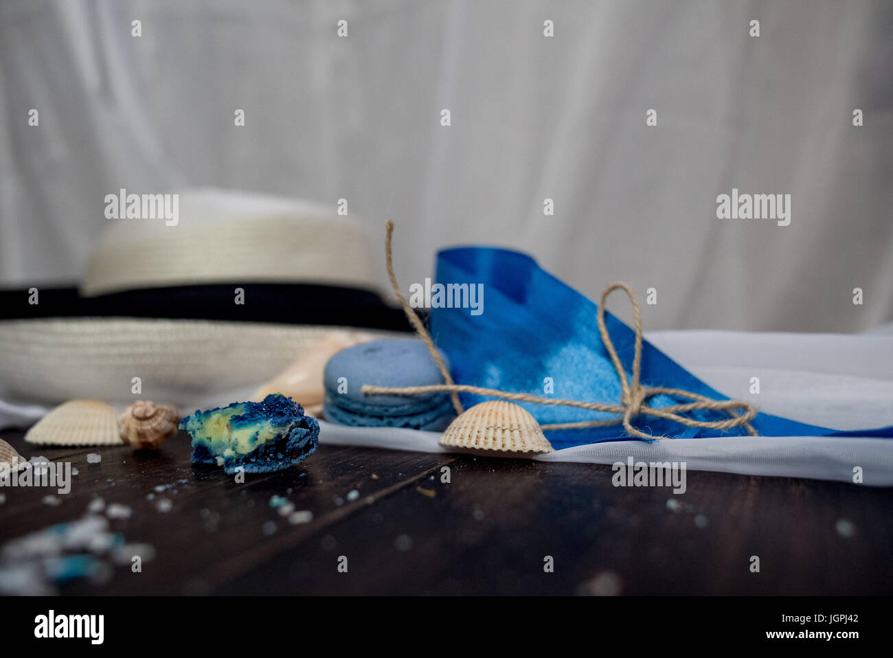 Blue and sea blue macaroons in a marine theme on a dark background ...