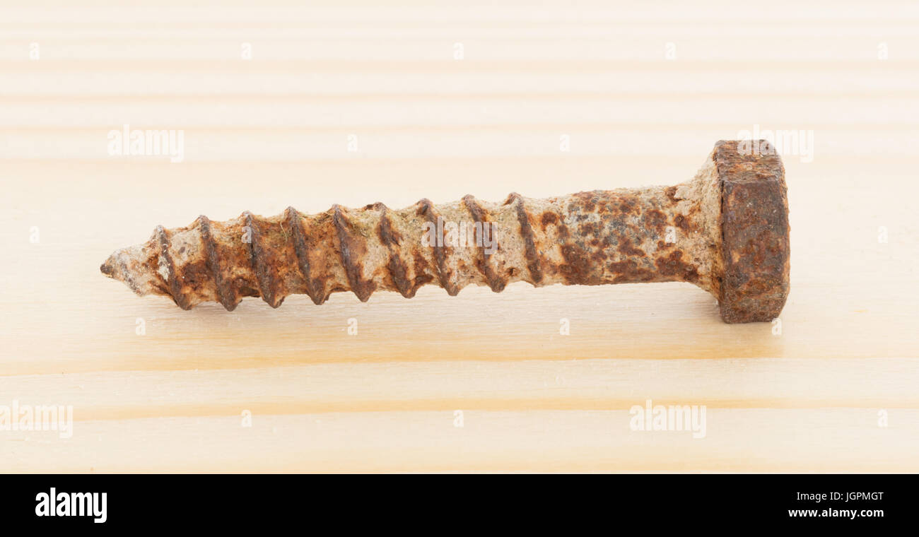 Rusted old screw isolated on white background Stock Photo - Alamy