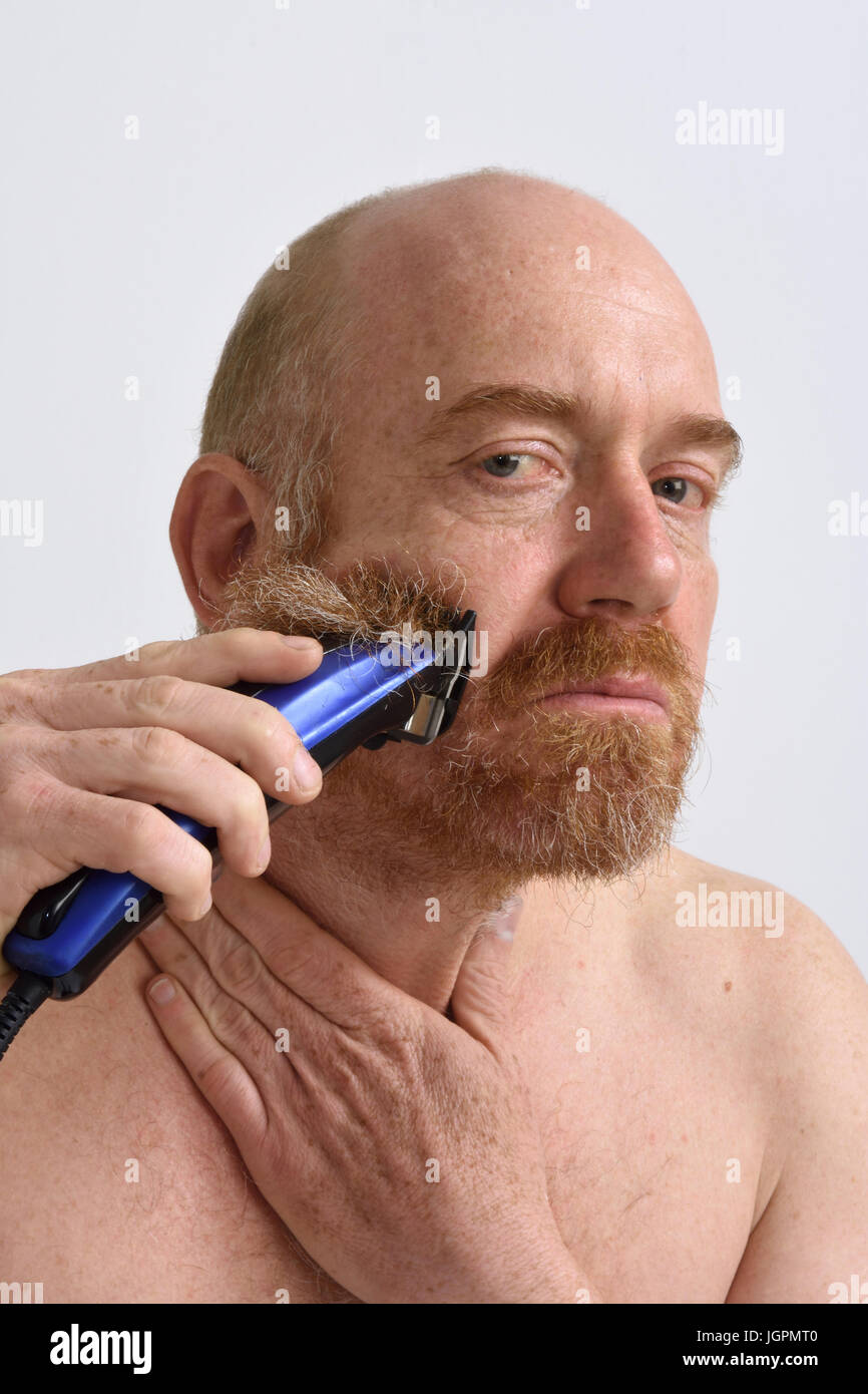 redheaded man shaving his beard Stock Photo - Alamy