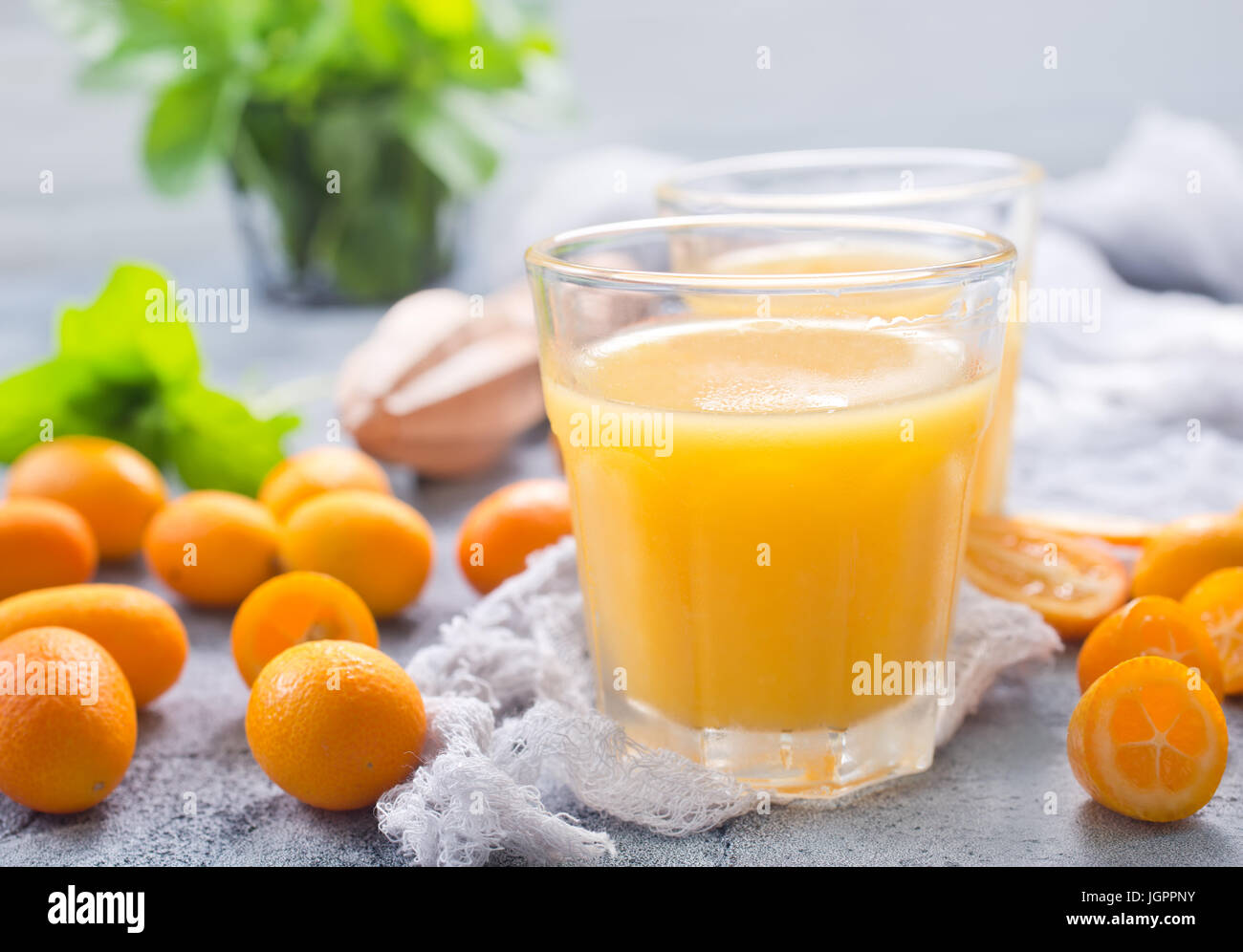 juice in glass and on a table Stock Photo - Alamy
