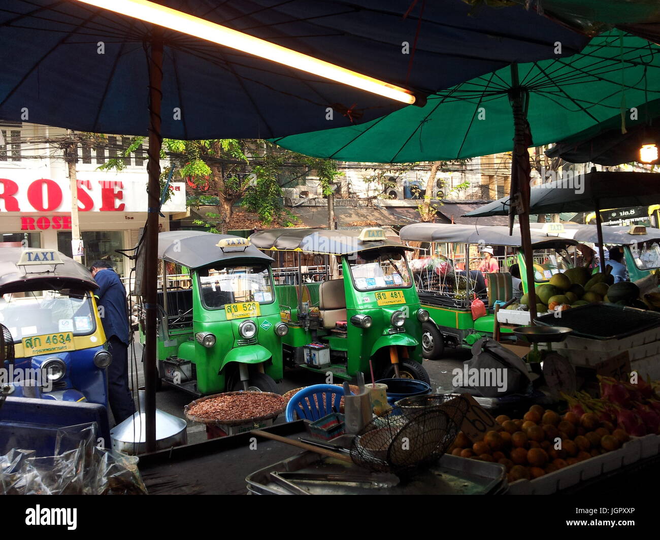Bangkok street market and local taxis Stock Photo - Alamy